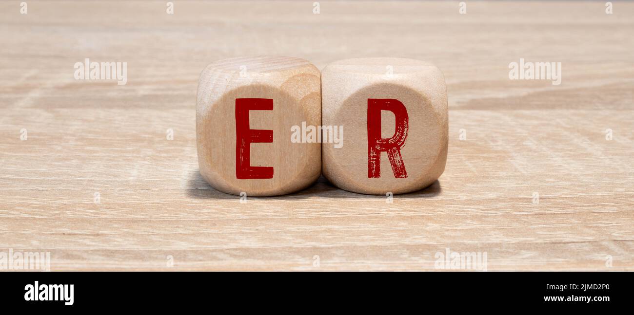 Medical stethoscope, wooden blocks with the inscription ER Emergency ...