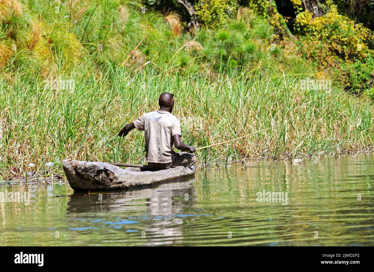 Anglers in dugout for fishing in the Okavango River in Botswana Stock ...
