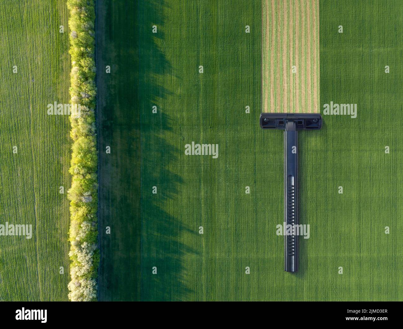 Green field with disposable shaving machine Stock Photo - Alamy