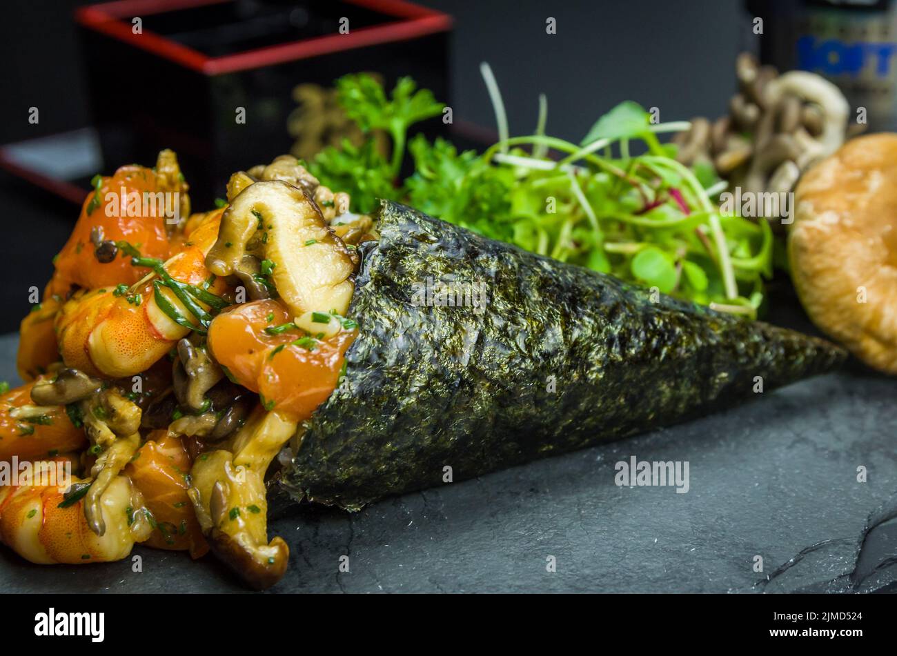 Temaki sushi. Traditional Japanese cuisine, premium Temaki of mushrooms ...
