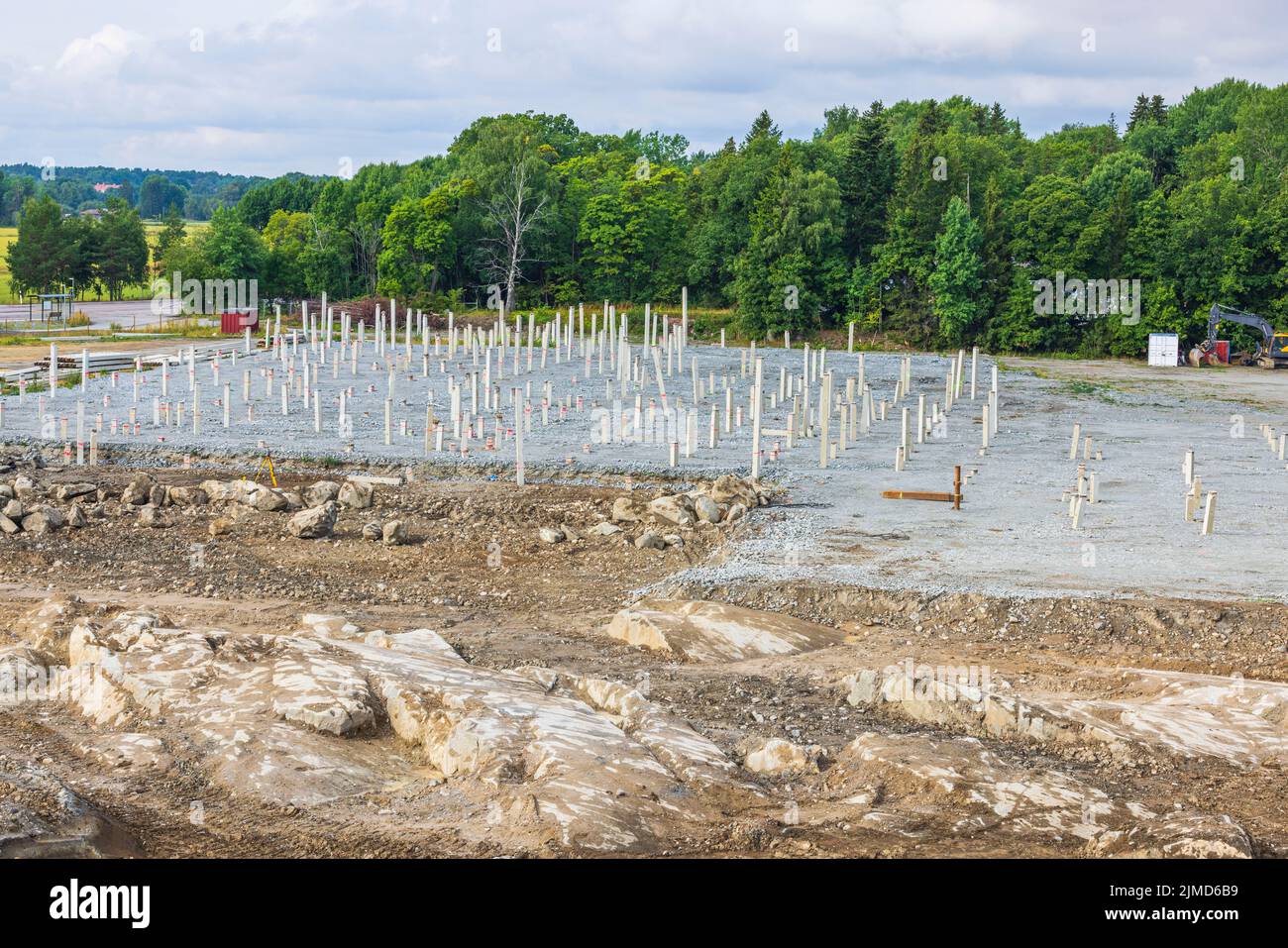 View of construction industrial area with concrete piles driven into ...