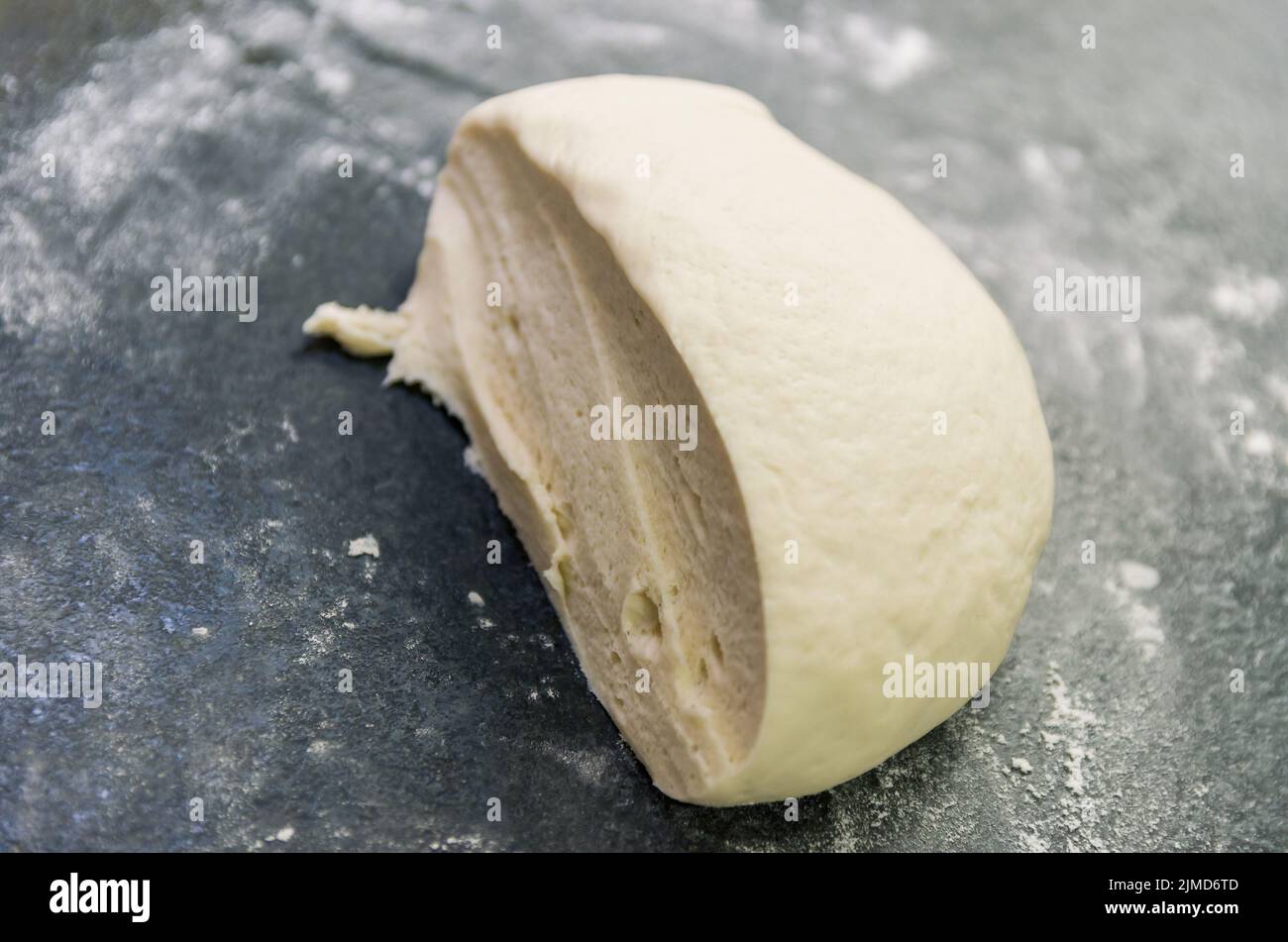 Preparation of pizza dough, dough resting Stock Photo - Alamy