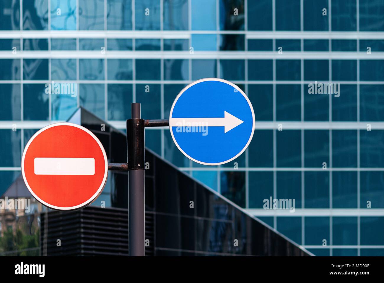 No entry and arrow to the right traffic sign in modern city ...