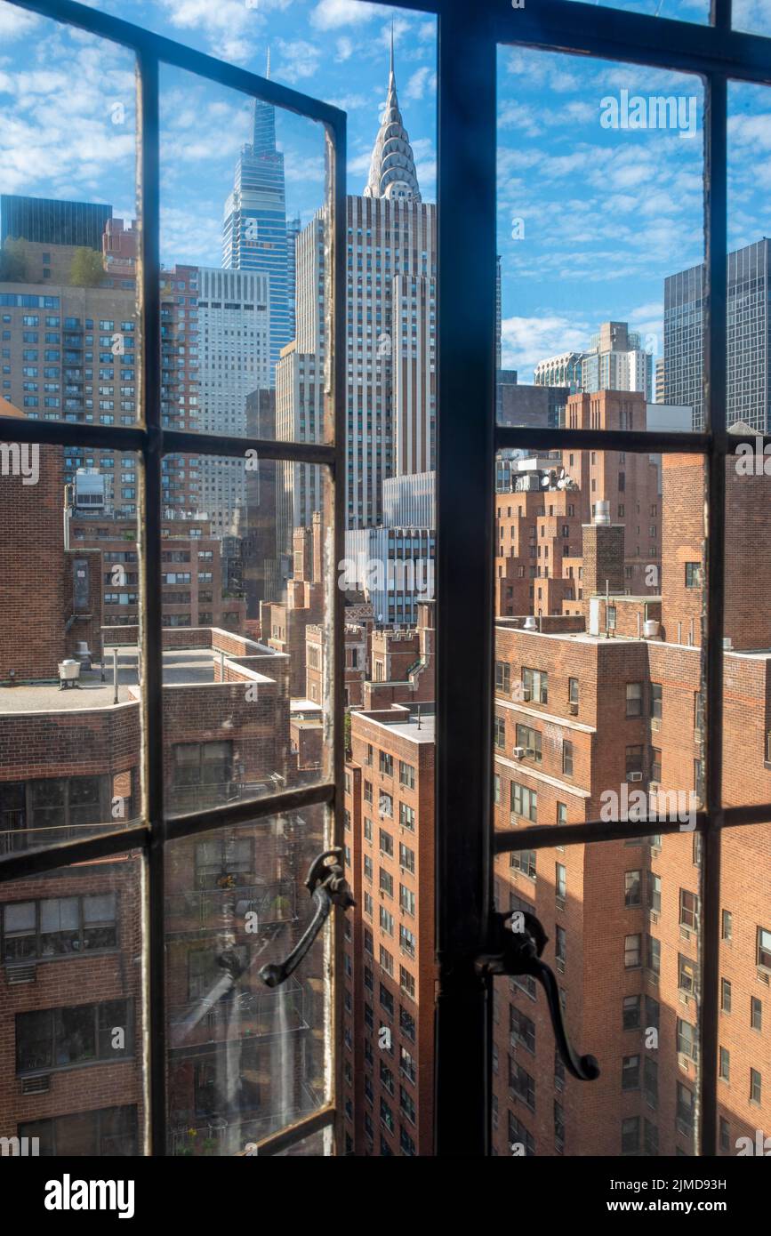 Manhattan skyline viewed through old fashioned open window Stock Photo ...