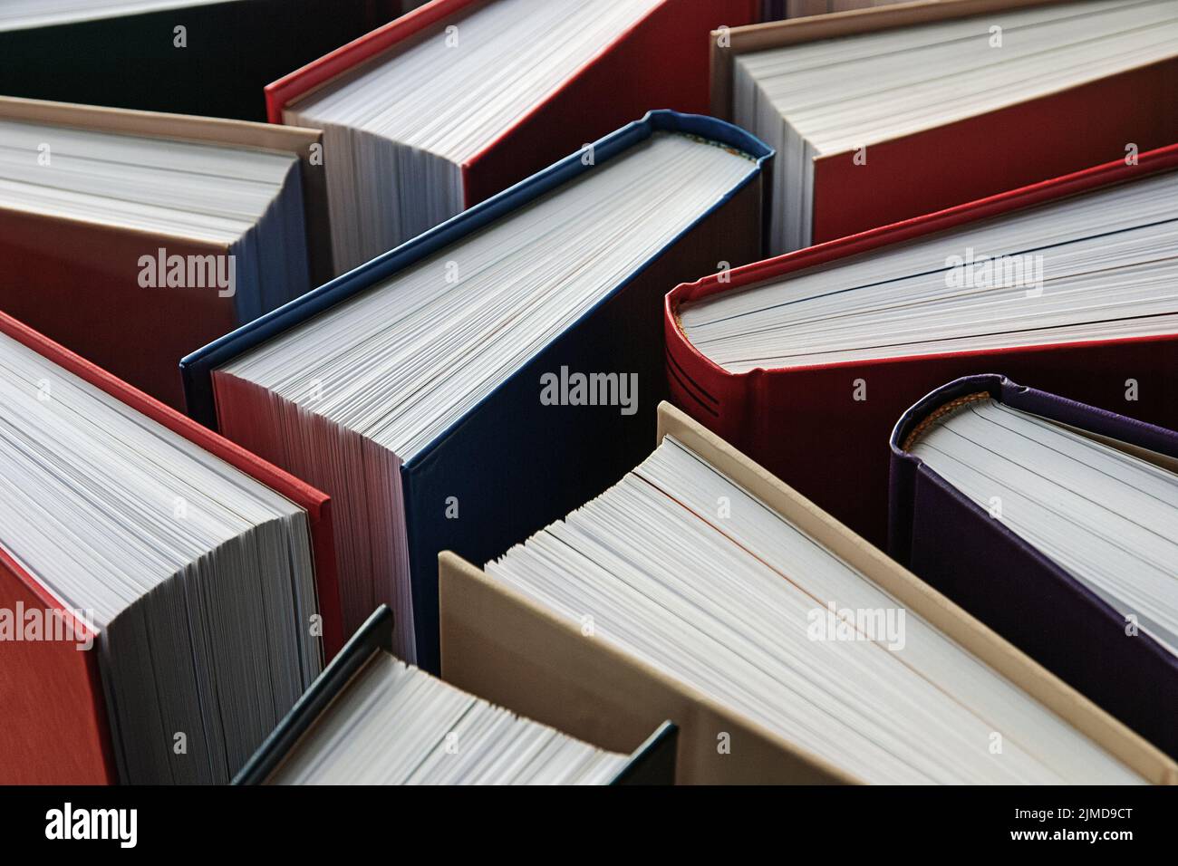Many hardbound paper books standing, literature background Stock Photo ...