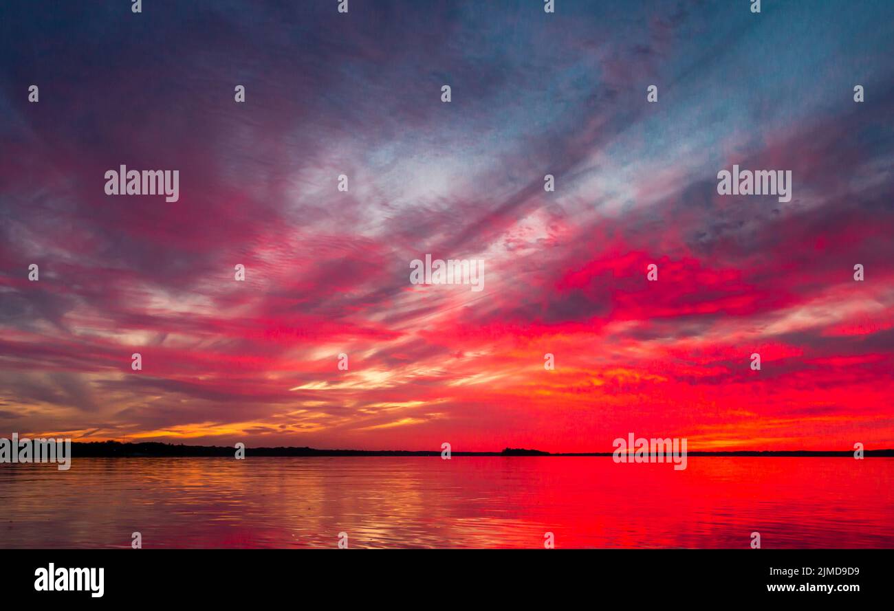 Sunset over the river Stock Photo - Alamy