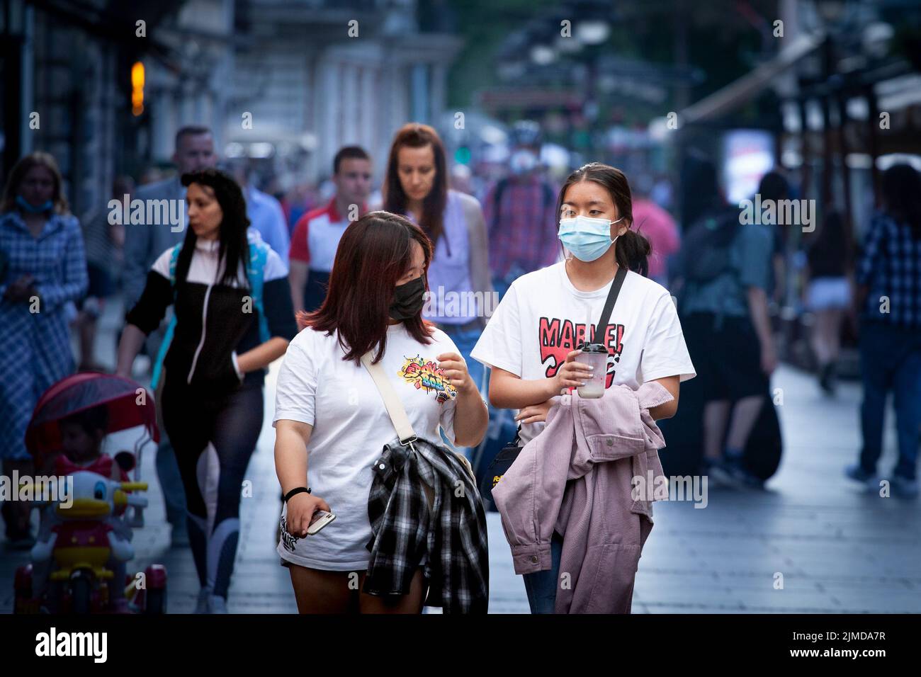 Asian people walking hi-res stock photography and images - Alamy