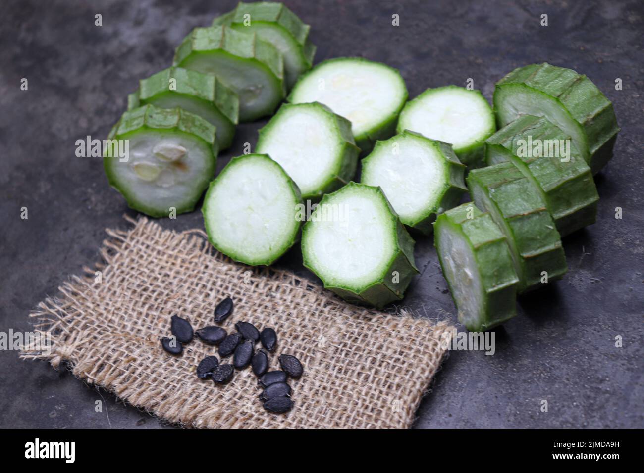 Ridges Gourd stock with seed on farm for farming Stock Photo - Alamy