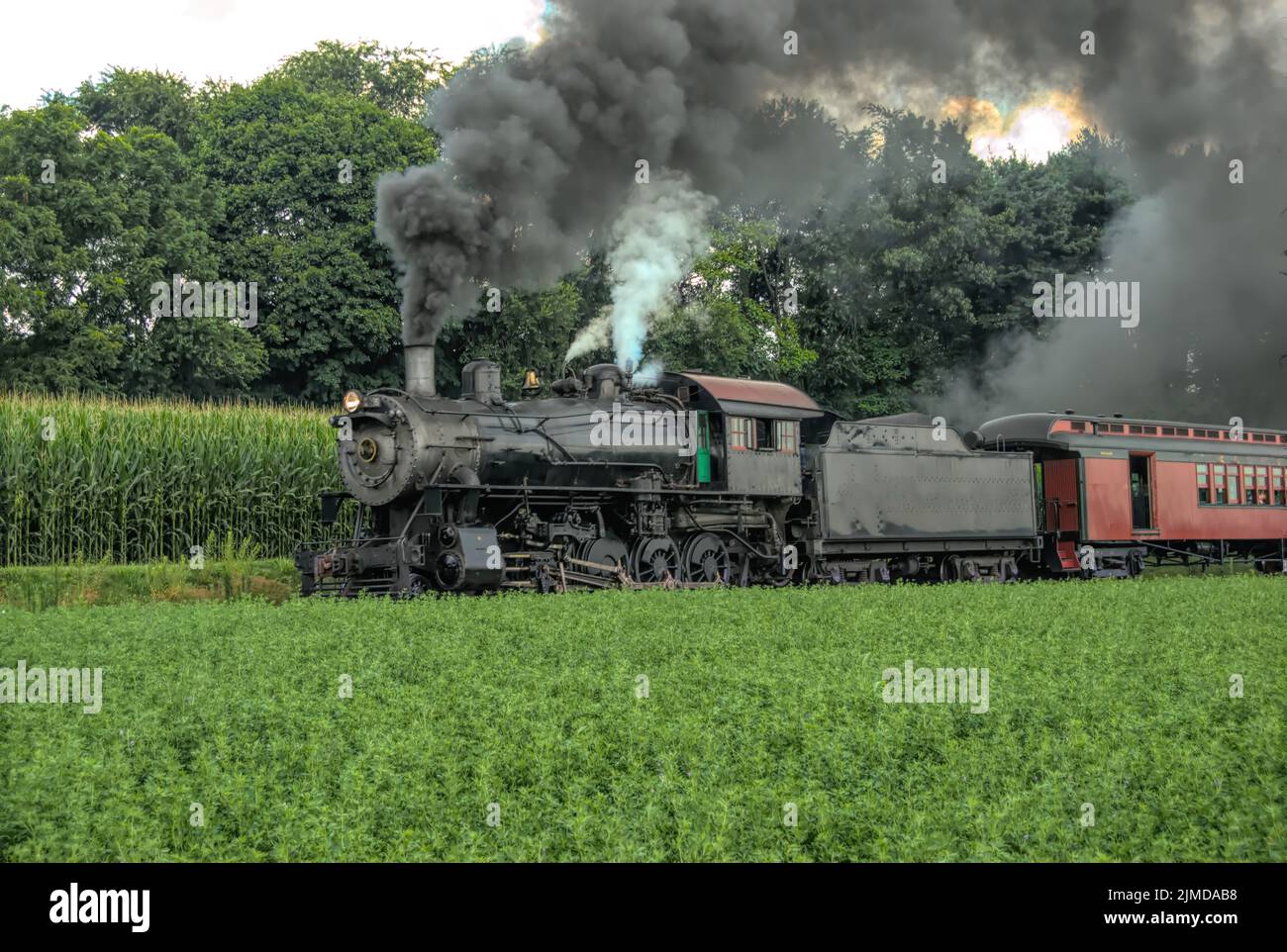 Restored Antique Steam Locomotive with Passenger Cars Stock Photo - Alamy