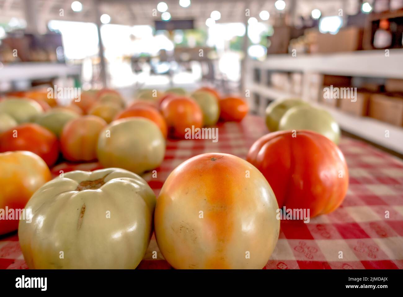 Tasty tomatoes on display at the farm market Stock Photo - Alamy