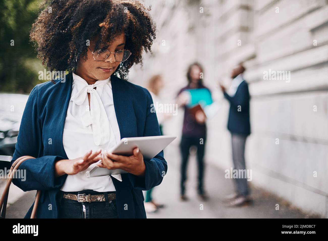 Young female tablet walking through hi-res stock photography and images ...