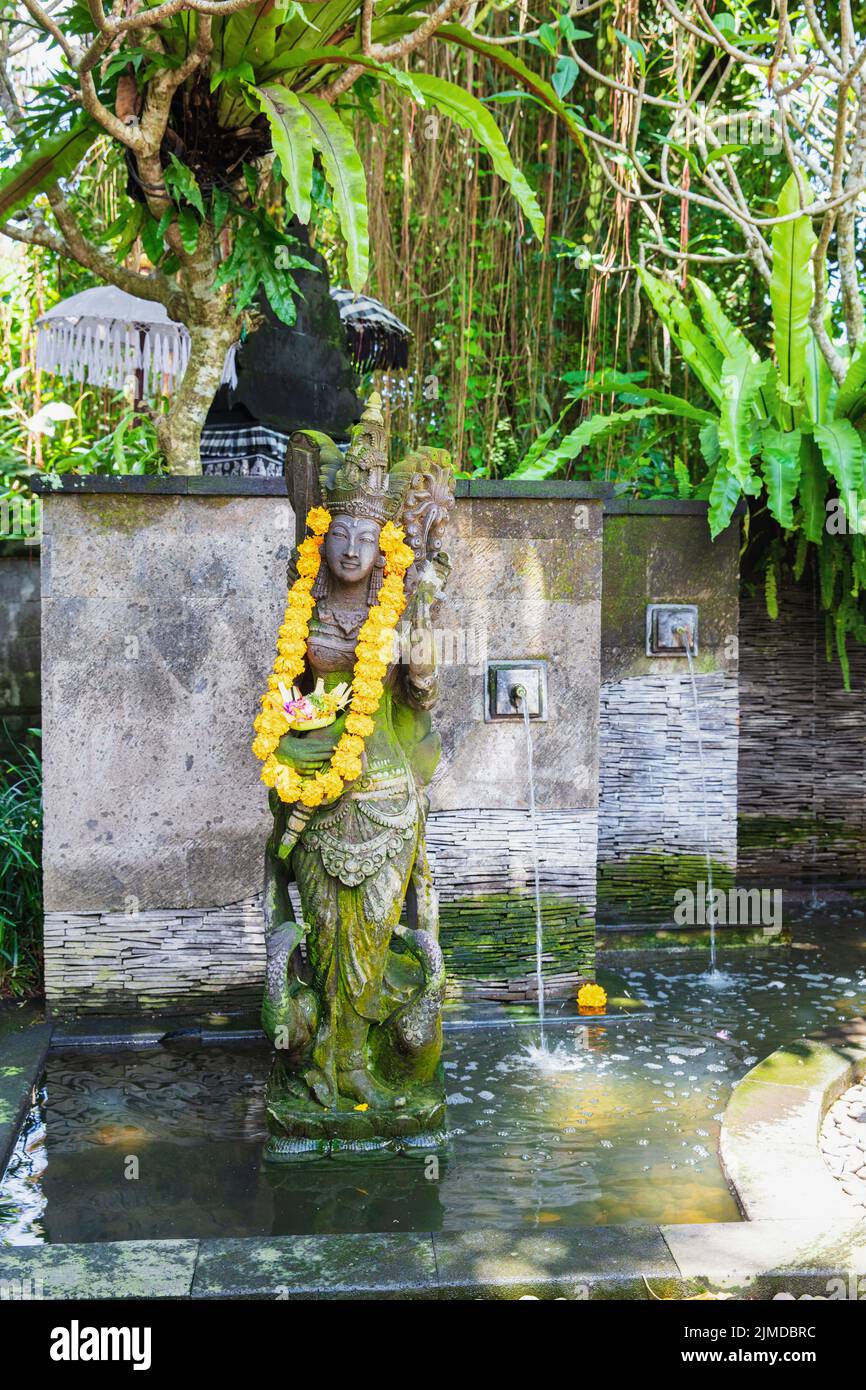 Traditional balinese statue Dewi Danu Stock Photo - Alamy