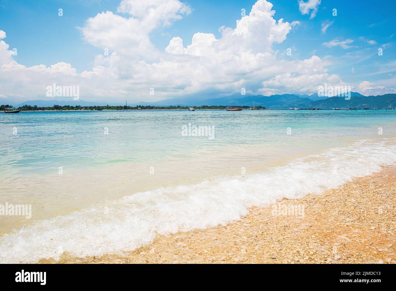Surf on a Coral beach Stock Photo - Alamy