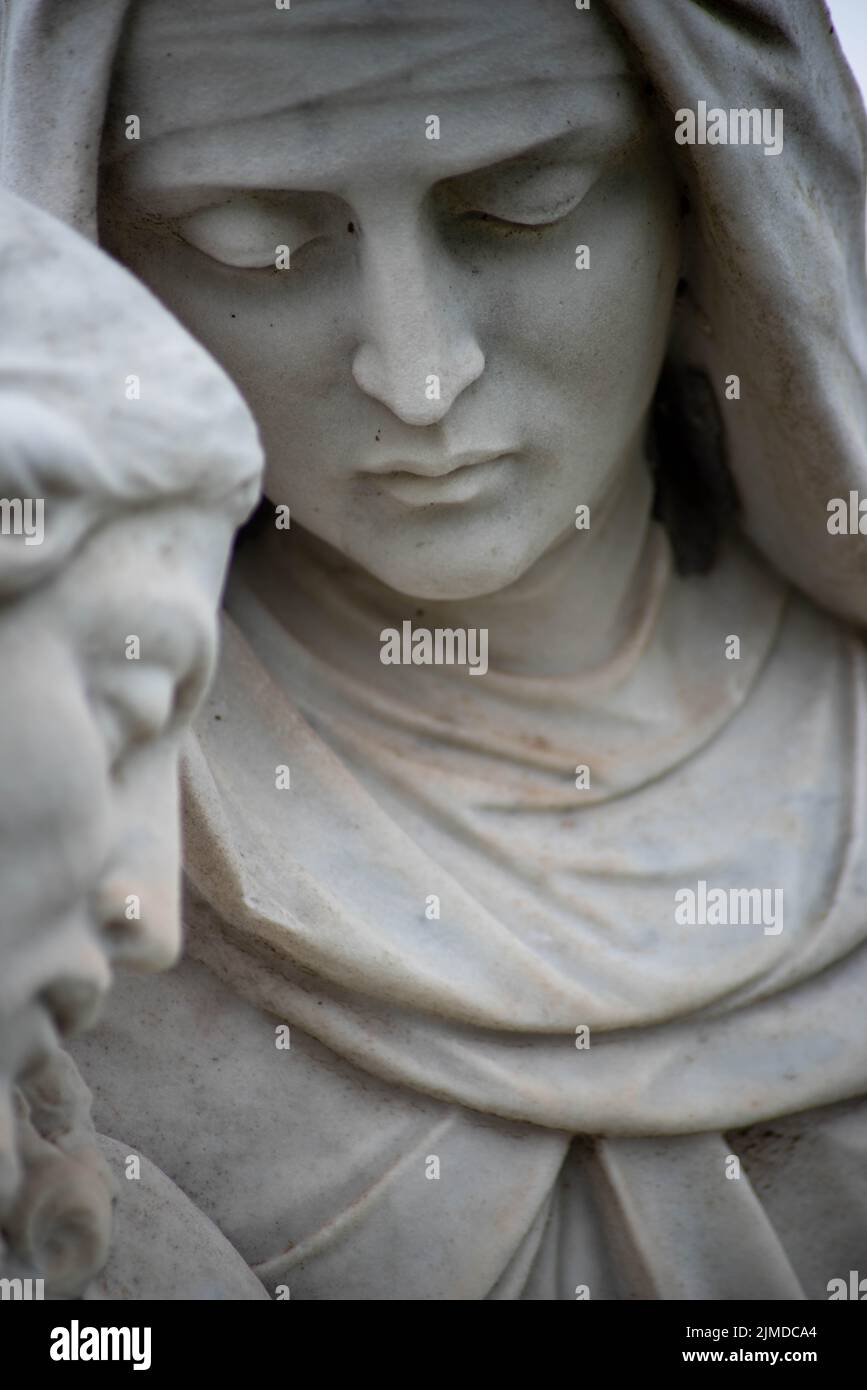 Close up of Mary's sorrowful face in Victorian cemetery pieta statue ...