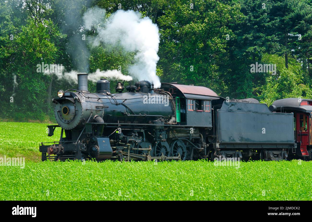 Steam Passenger Train Puffing along Amish Countryside Stock Photo - Alamy