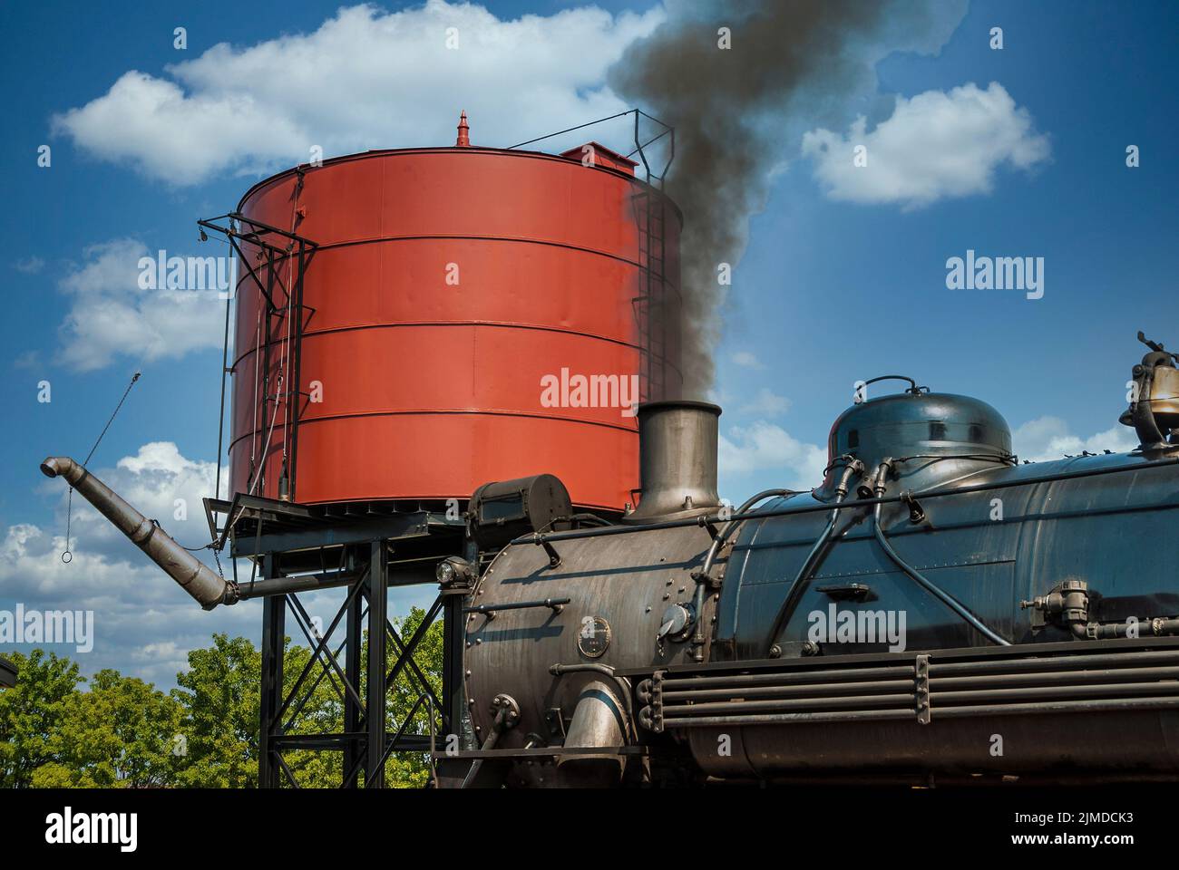 Steam Engine to get Water by Water Tower Stock Photo - Alamy