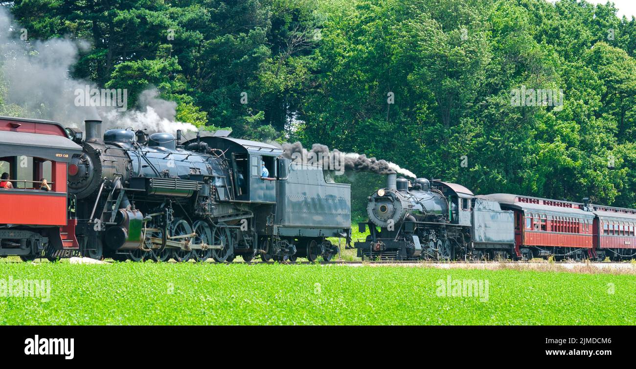 2 Antique Steam Passenger Train Puffing Lots of Black Smoke Stock Photo ...