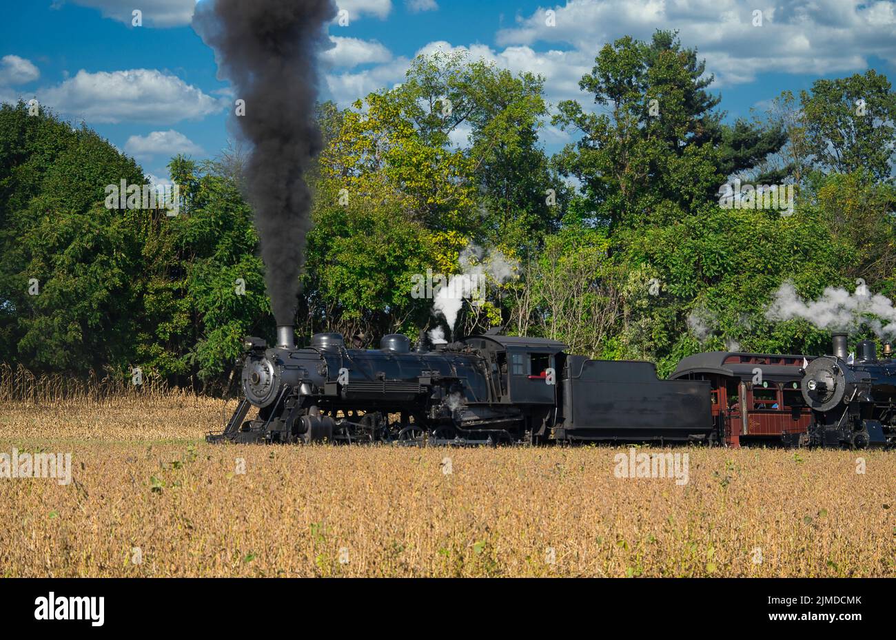Close up of an Antique Steam Freight Train Puffing Smoke and Steam ...