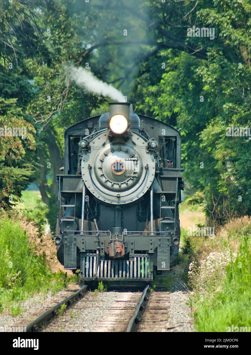 Close Up of an Antique Steam Passenger Train Puffing Along Stock Photo ...