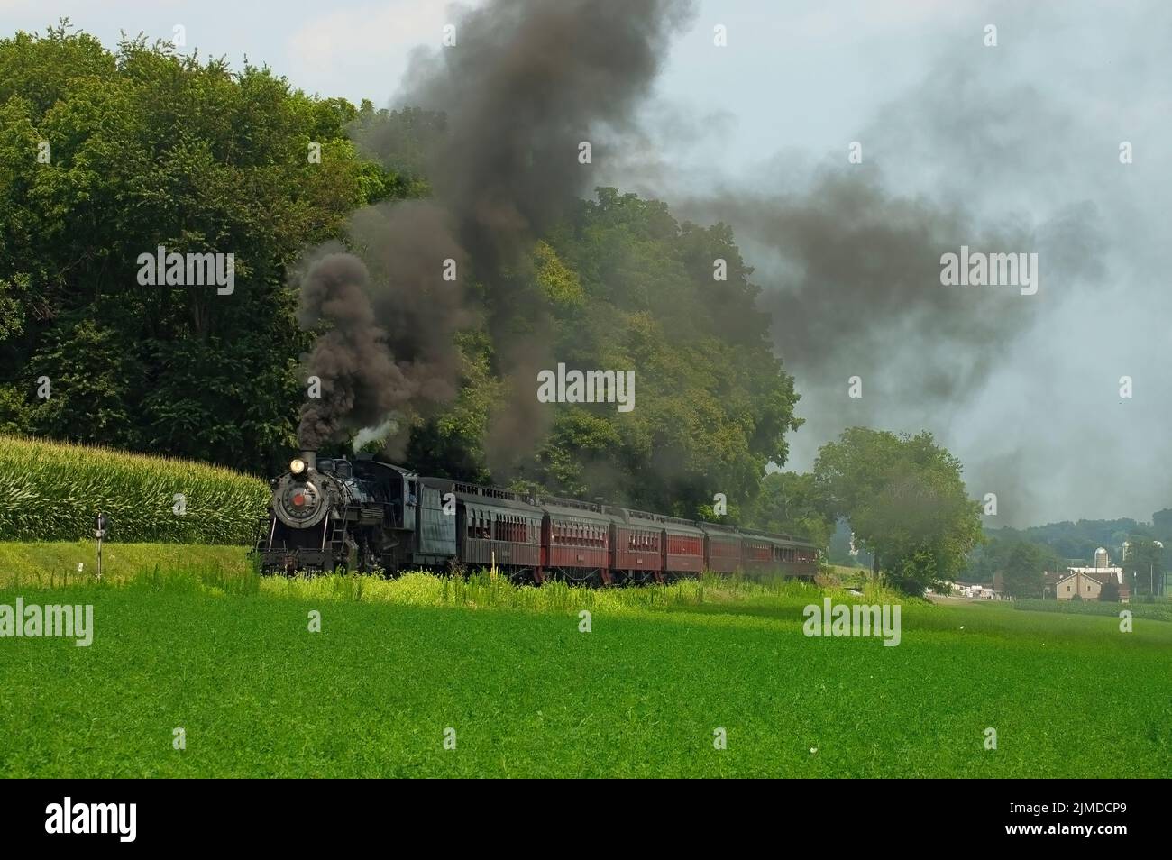 Steam Passenger Train Puffing along Amish Countryside Stock Photo - Alamy