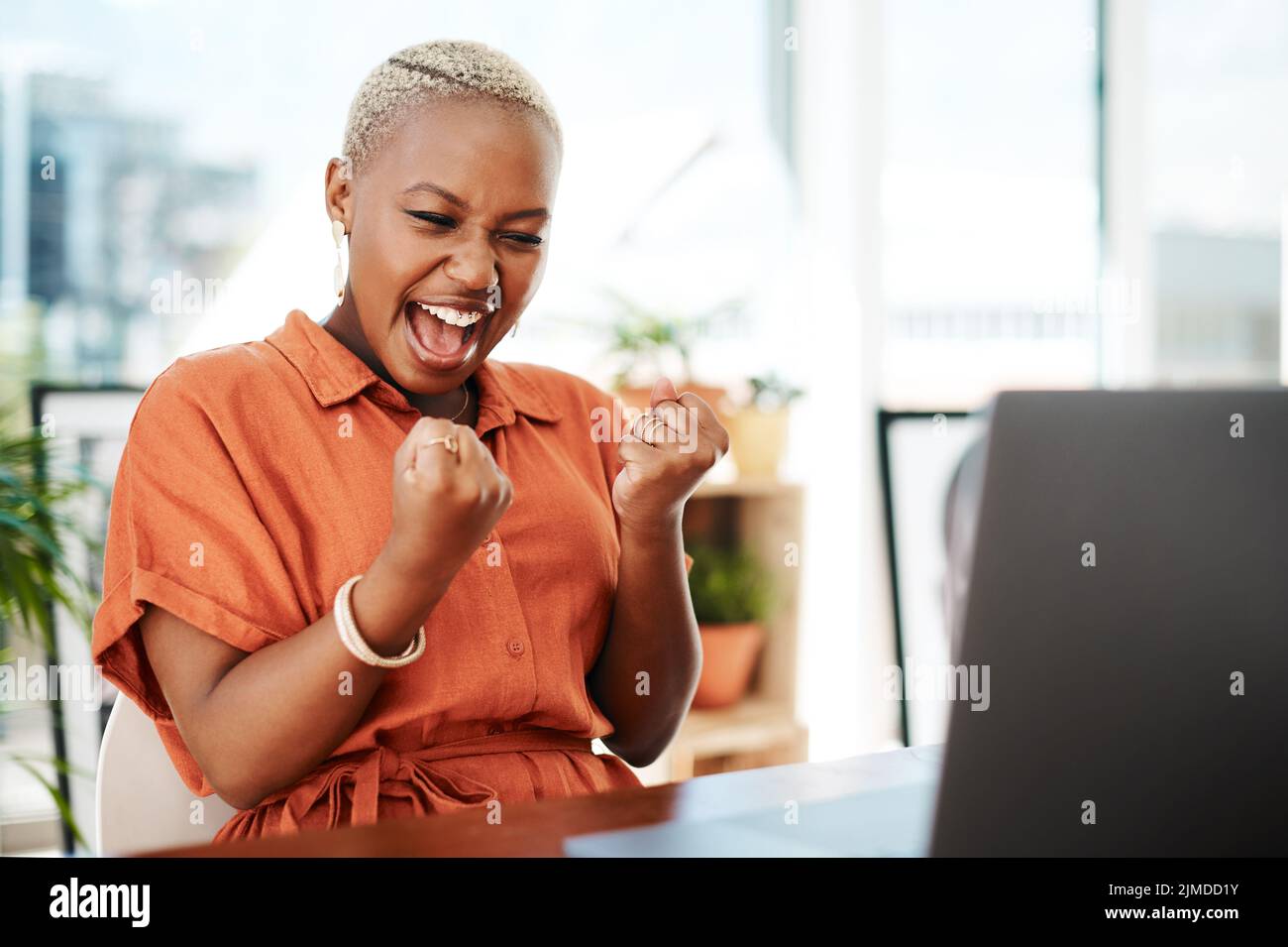 Becoming An Achiever Is Easy For A Believer A Young Businesswoman Cheering While Working In An