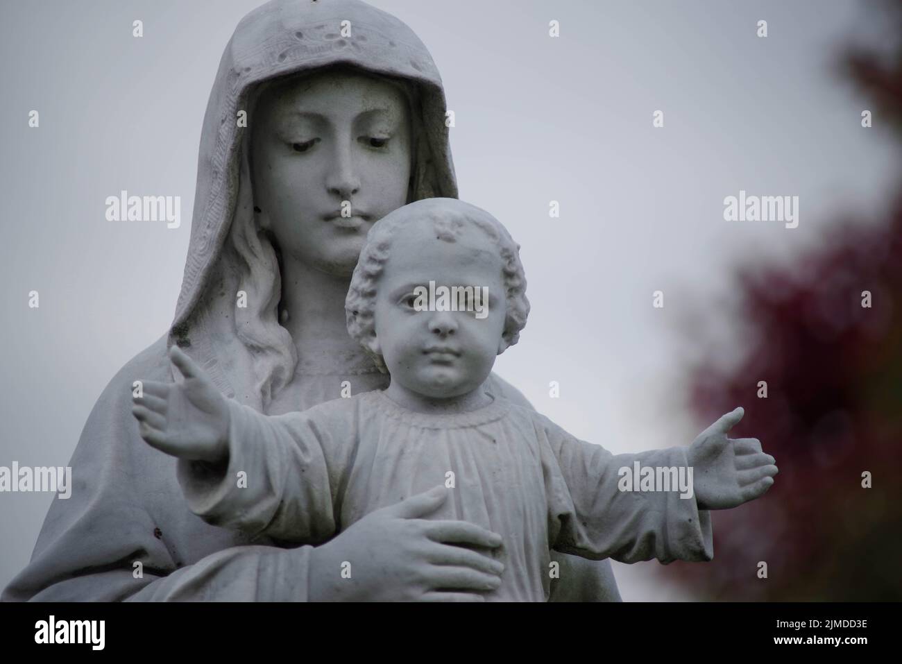Christ Child cemetery stature with outstretched arms Stock Photo - Alamy