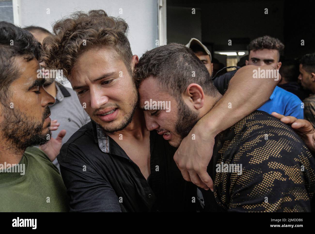 Palestinians mourn over the body of Tayseer al-Jabari, a commander in ...