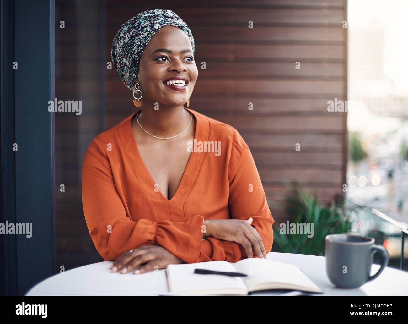 Keeping her eyes fixed on the future. an attractive businesswoman ...