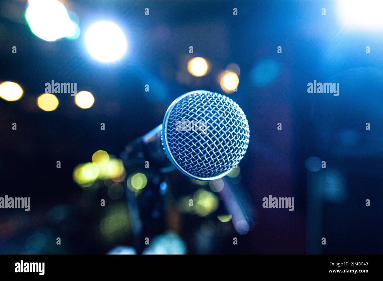 Microphone grid at close range in the spotlights before the concert ...