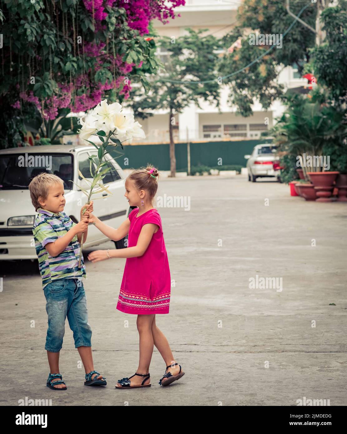 Kids walking by the street Stock Photo - Alamy