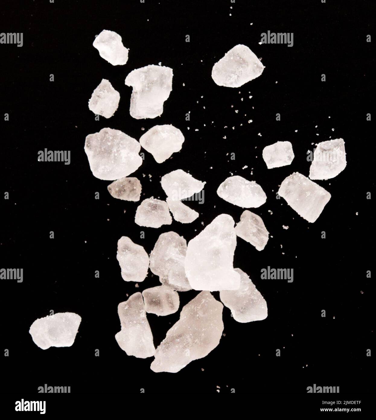 Salt on black Stock Photo - Alamy