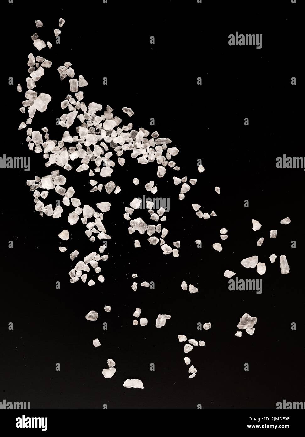 Salt on black Stock Photo - Alamy