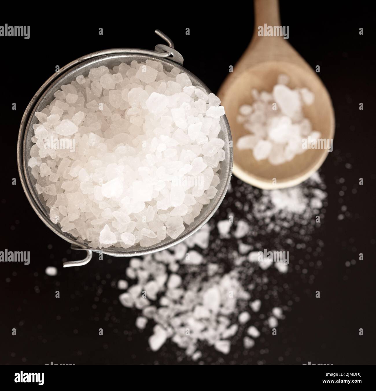 Salt on black Stock Photo - Alamy