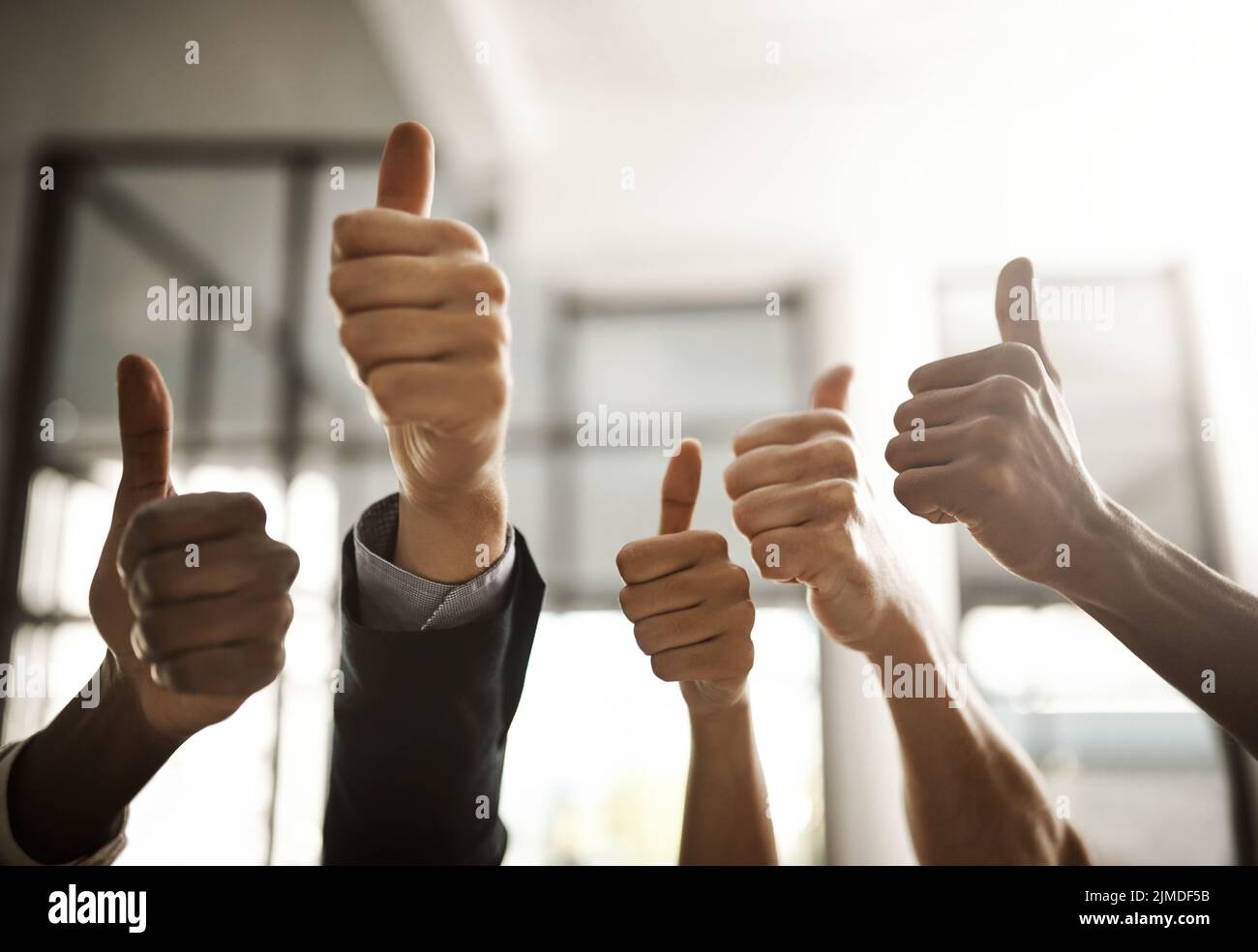Teamwork, collaboration and thumbs up sign from diverse businesspeople ...