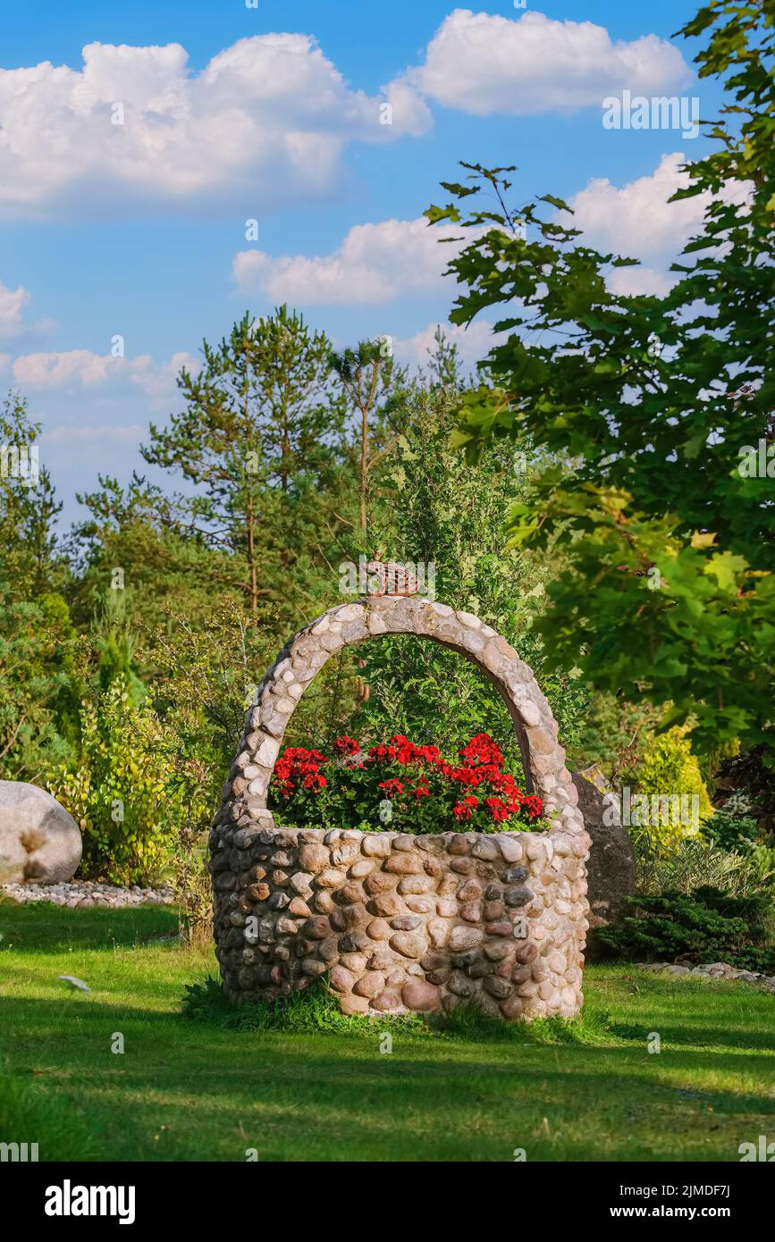 Flower basket made of stone Stock Photo - Alamy