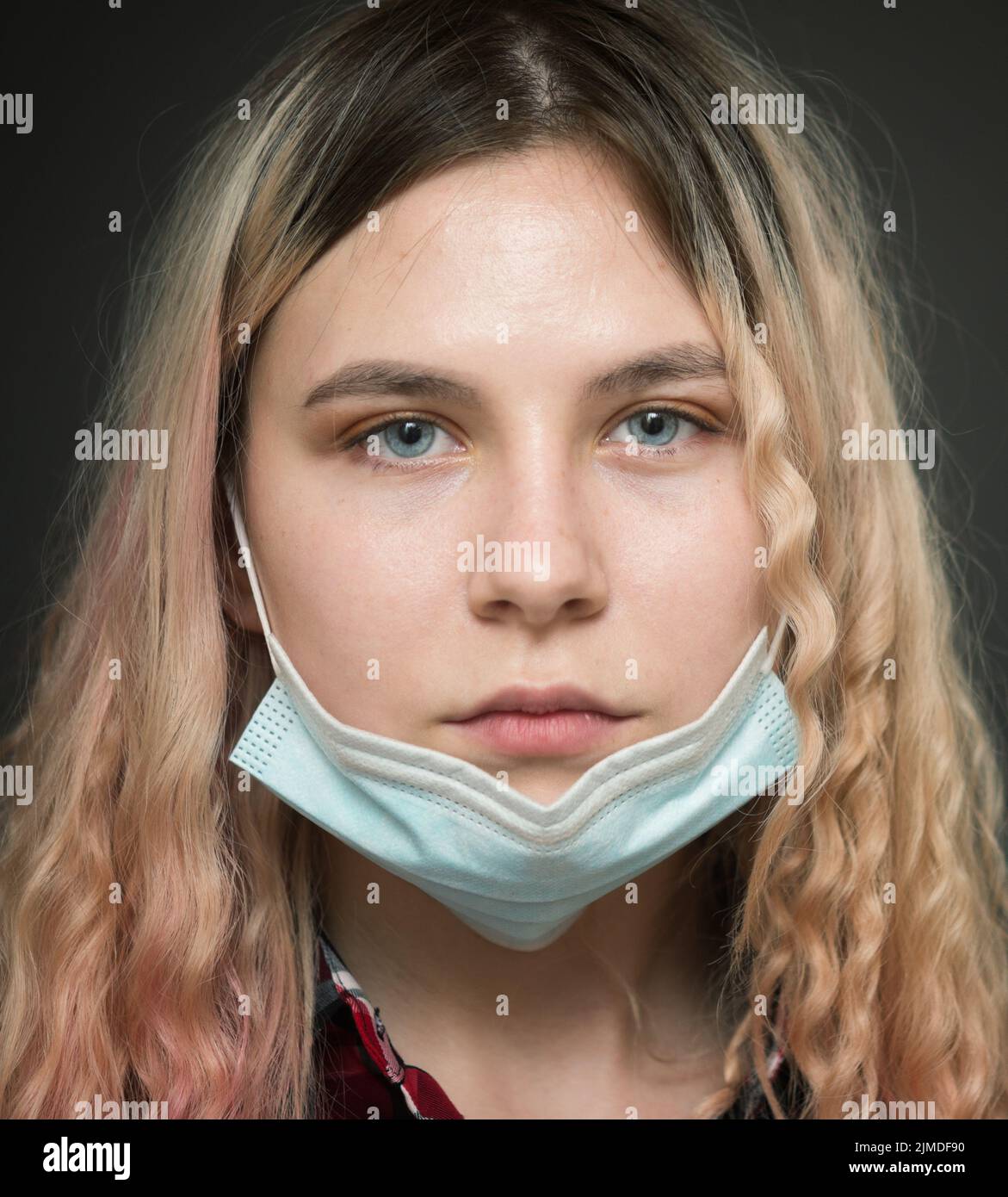 Woman wearing respiratory surgical hi-res stock photography and images ...