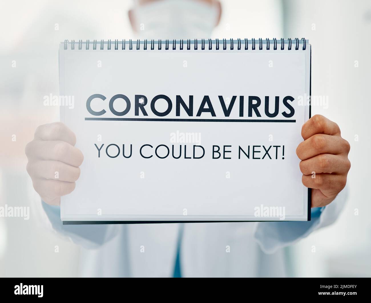 You never know, stay at home. a scientist holding a sign with ...