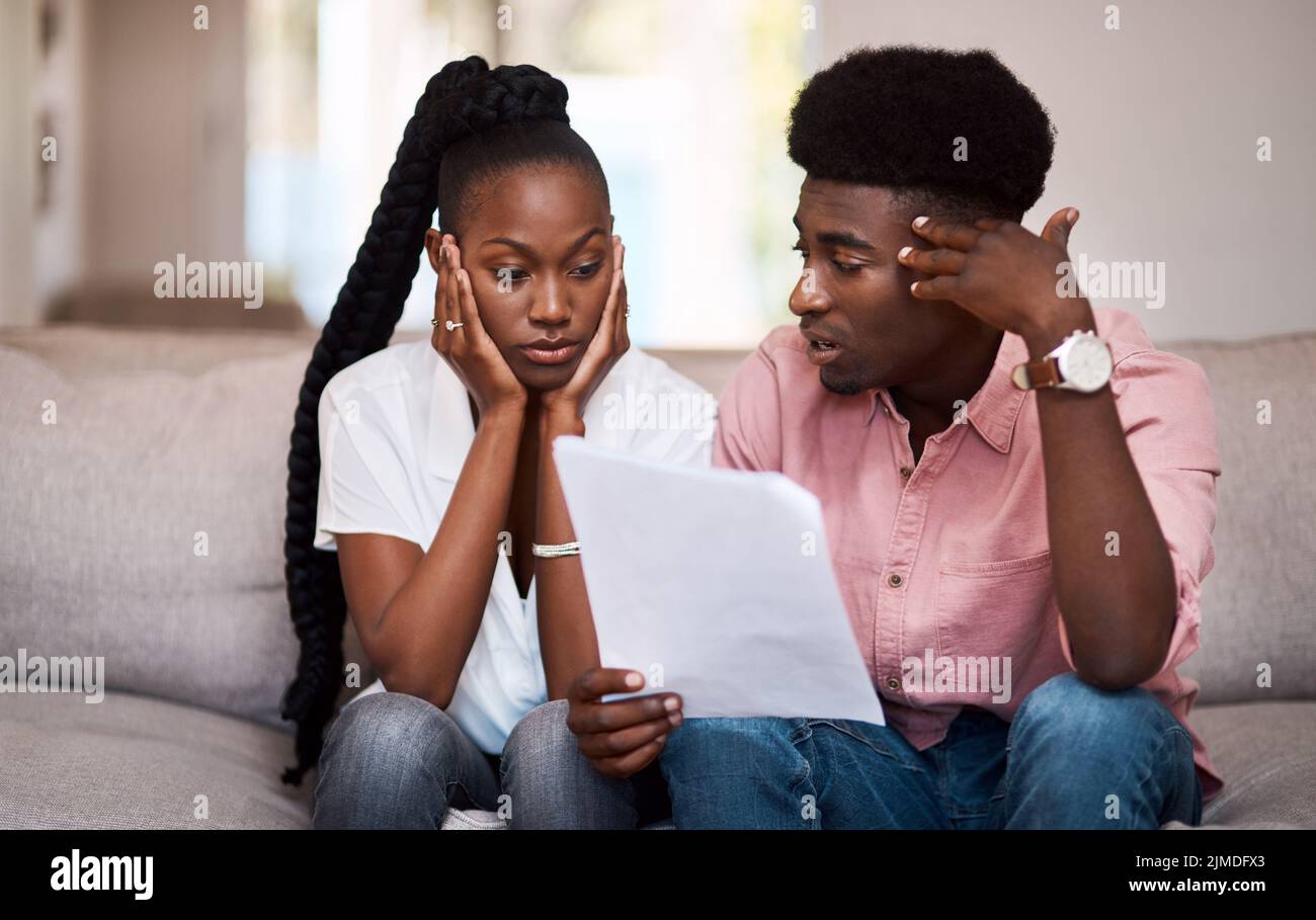 Well have to take out another loan. a young couple looking stressed ...