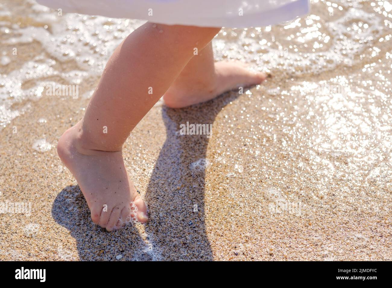 Child feet sand hi-res stock photography and images - Alamy