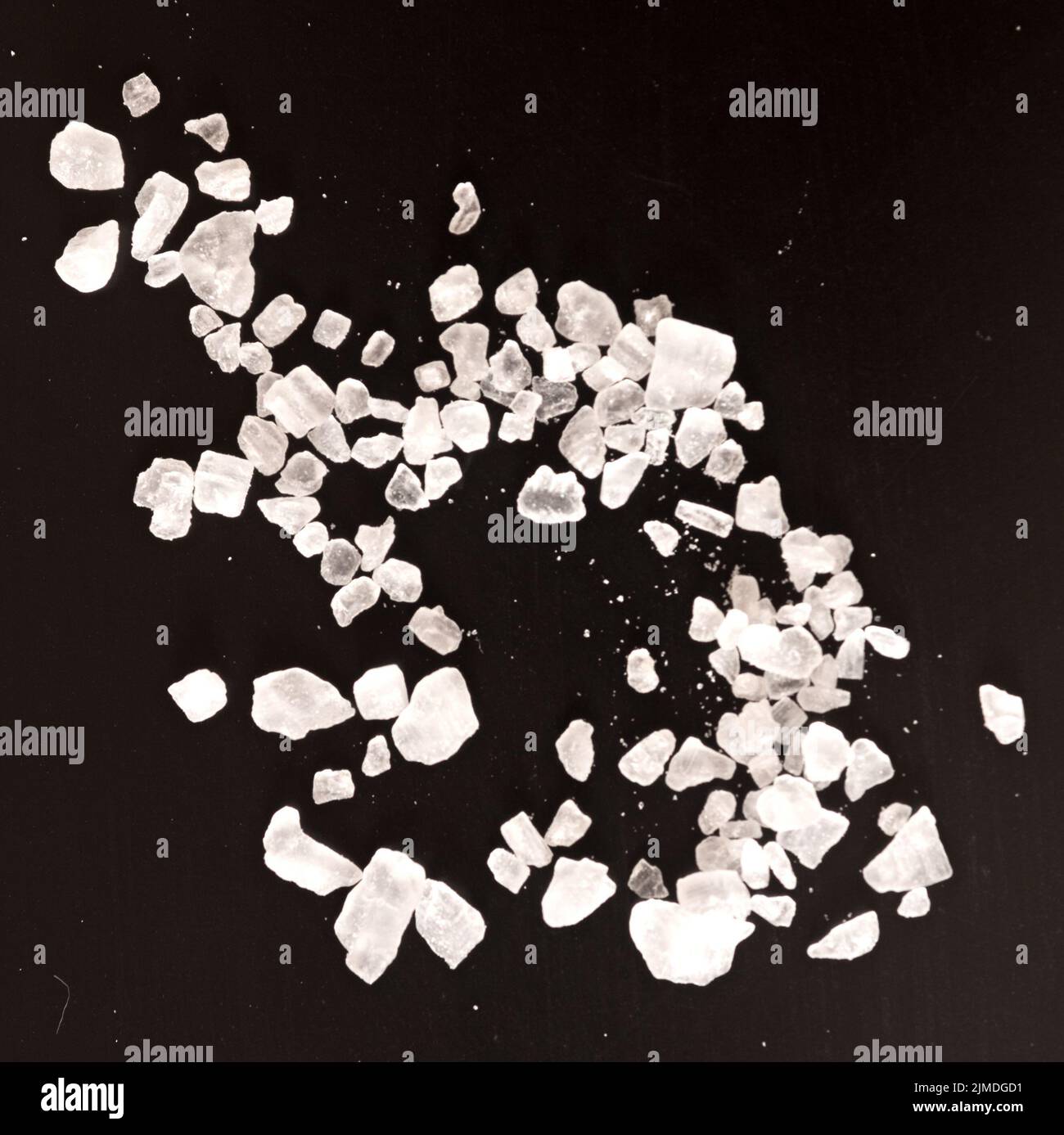 Salt on black Stock Photo - Alamy