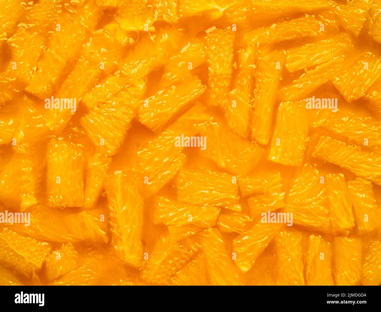 Flatlay. Pieces of juicy oranges in a transparent fragrant edible gel ...