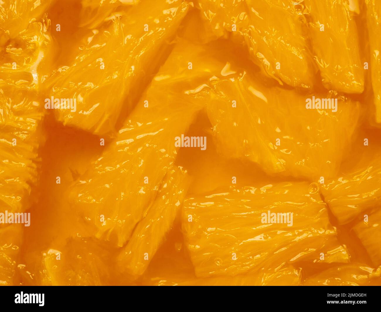 Flatlay. Pieces of juicy oranges in a transparent fragrant edible gel ...