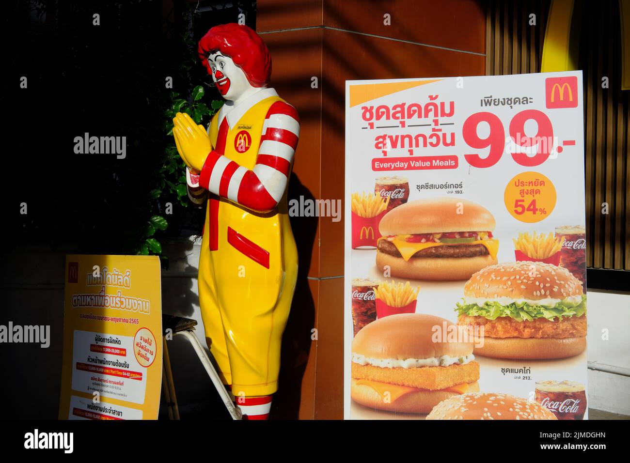 A McDonald's outlet in Bangkok, Thailand, the trademark clown performing a traditional Thai 'wai ...