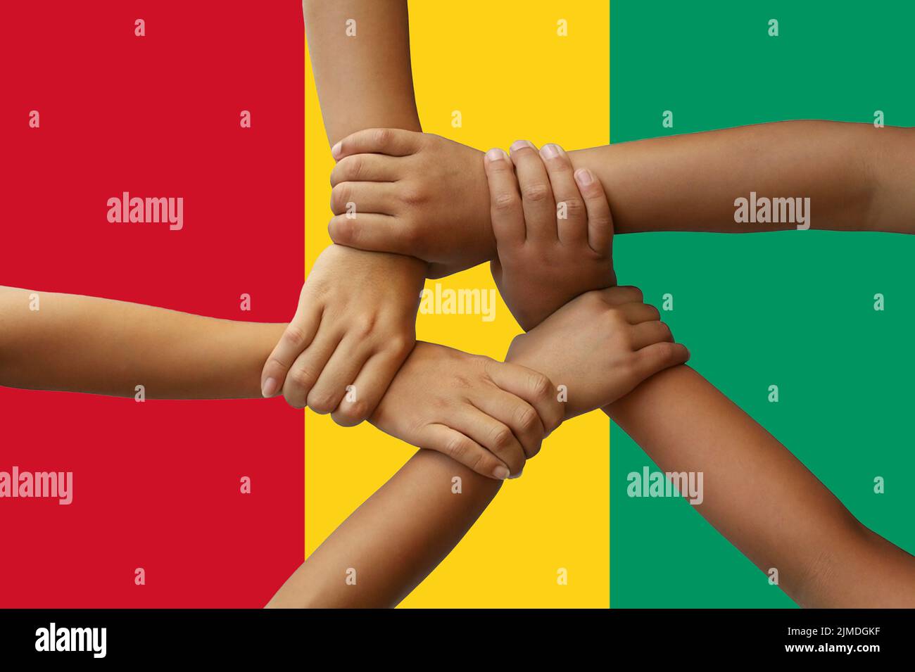 Flag of Guinea, intergration of a multicultural group of young people ...