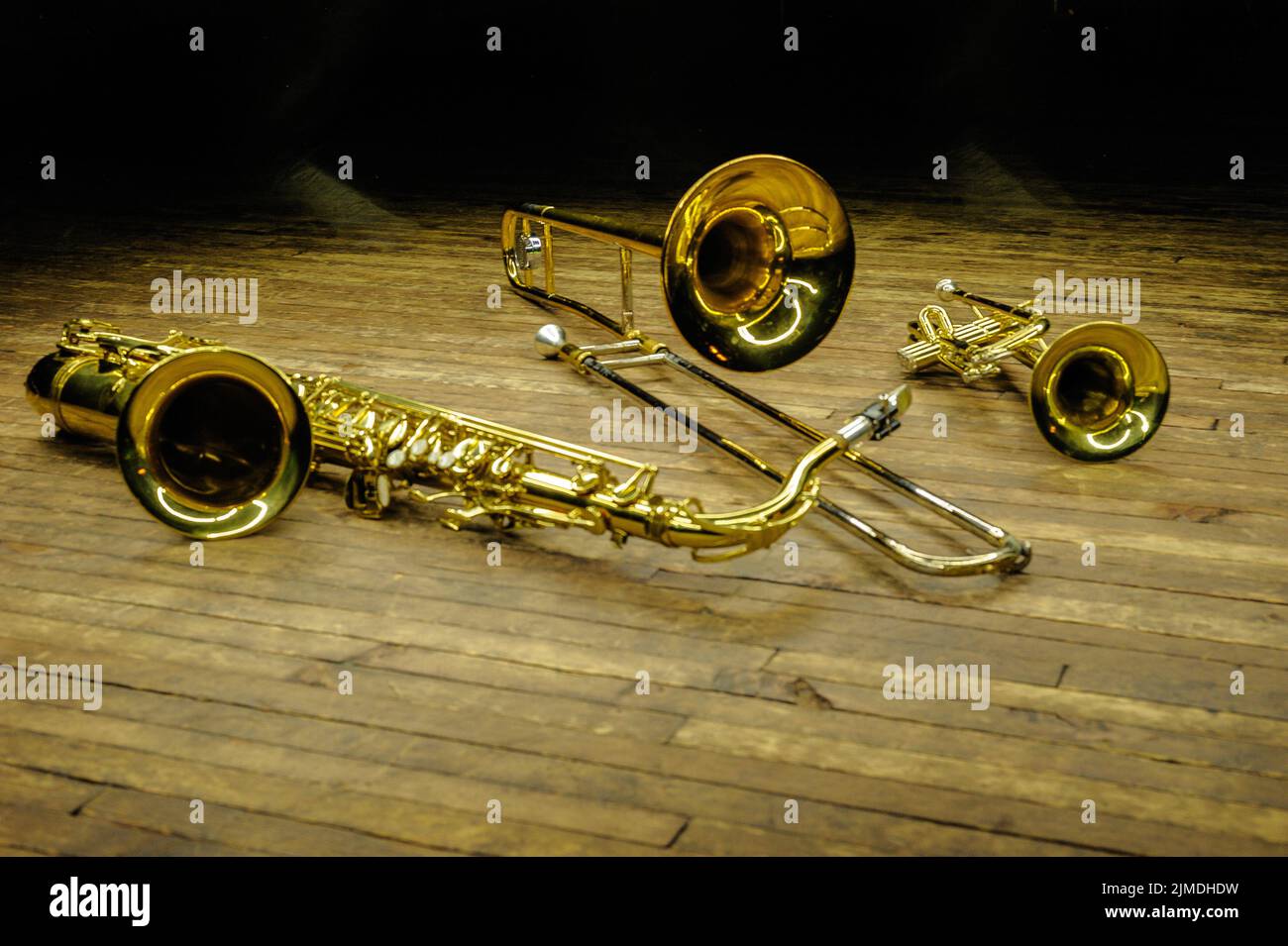 Yellow brass and wind instruments - saxophone, trombone, trumpet on ...