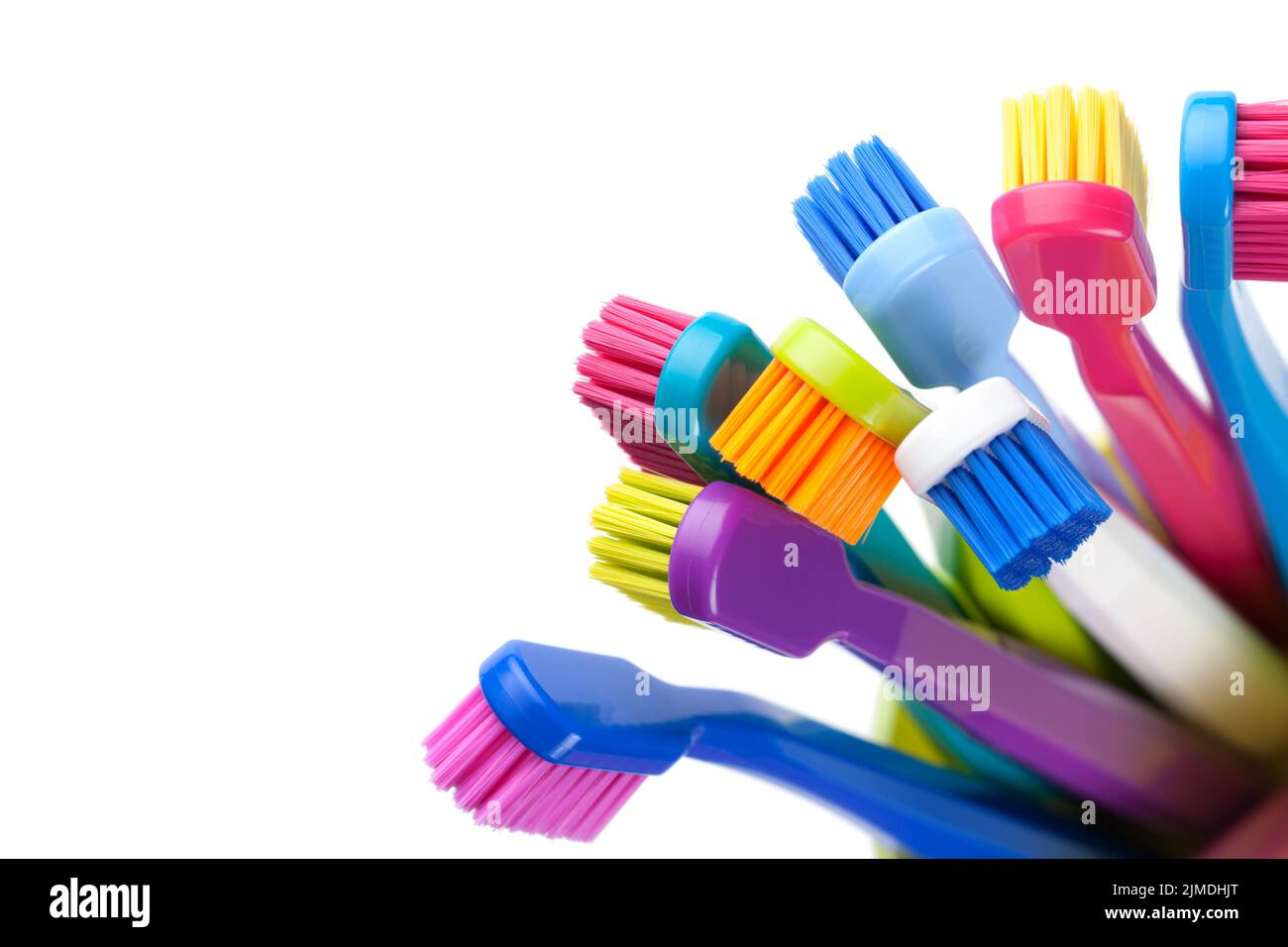 Group Of Colorful Toothbrushes In Cup Isolated Stock Photo - Alamy