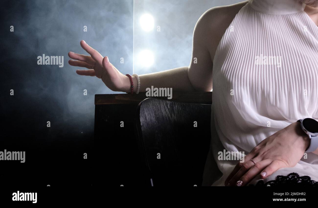 Hand gesture in the dark in backlight through the smoke Stock Photo - Alamy