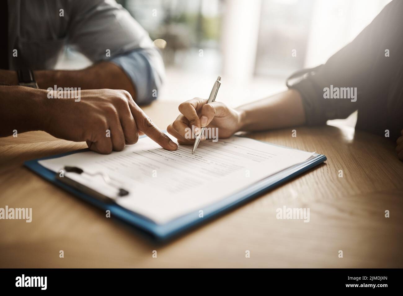 Lawyer, broker or HR manager pointing finger at contract and signing ...