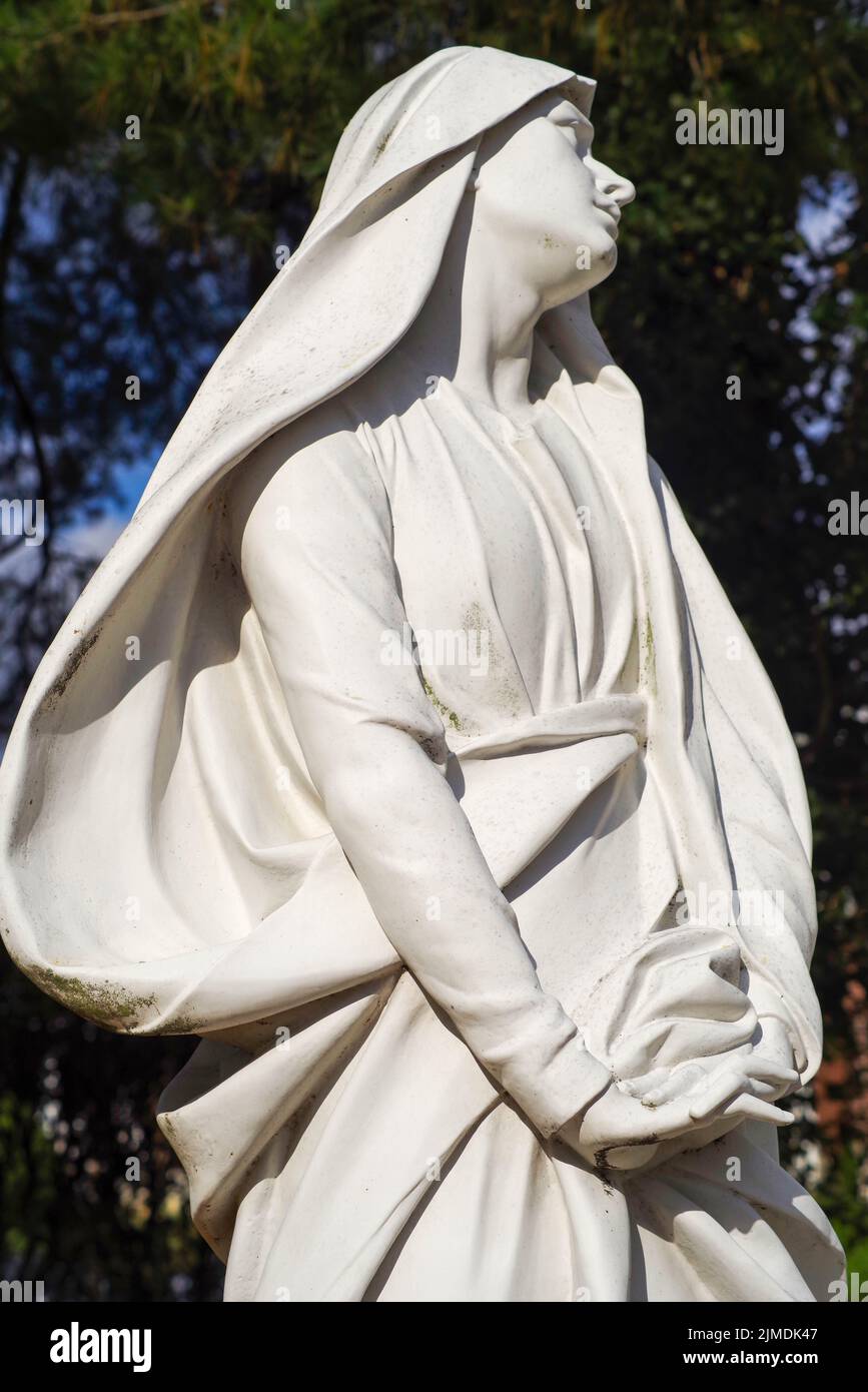 Young Virgin Mary cemetery statue Stock Photo - Alamy