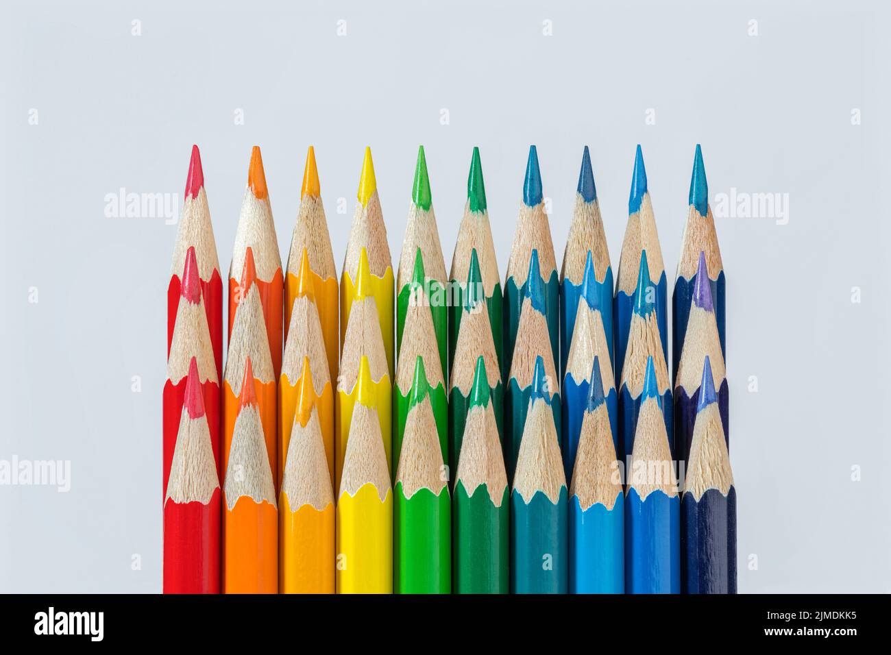 Three rows of colored pencils against a white background Stock Photo ...